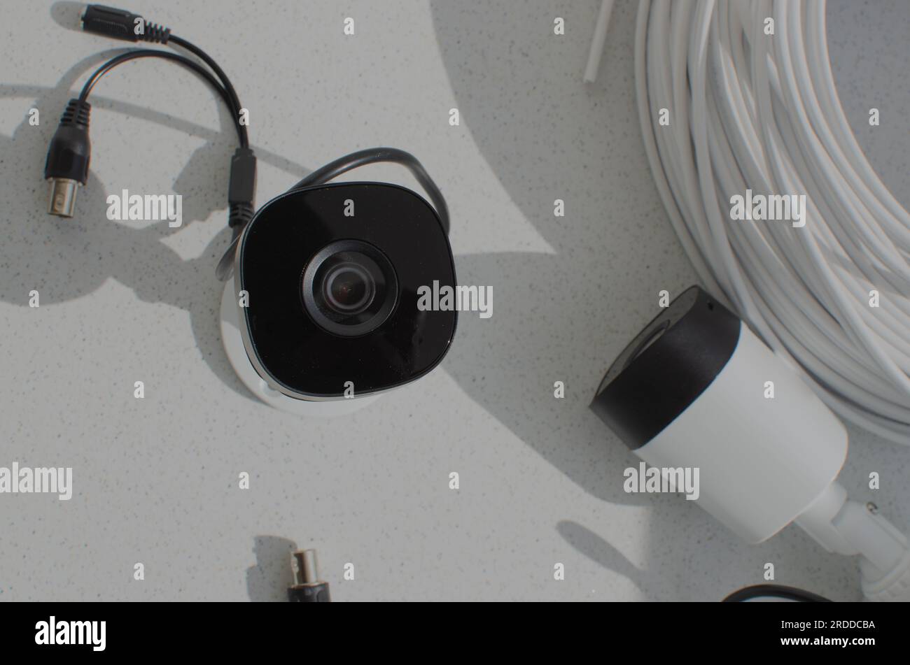 Close-up security camera with wire roll, conveying confidence and peace ...