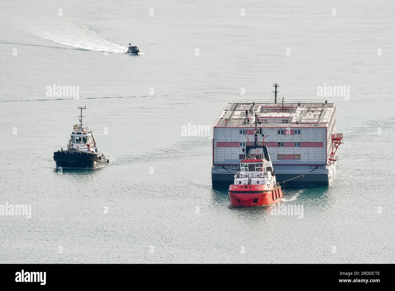 The asylum accommodation barge the Bibby Stockholm arrives at Portland Port near Weymouth in ...