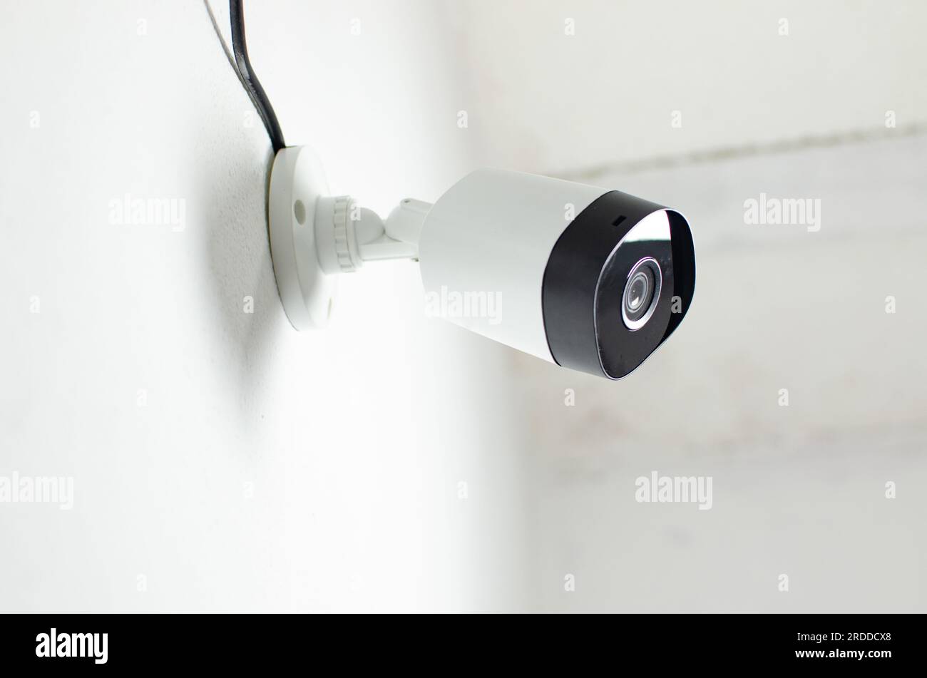 Detail of a white security camera, showing the fundamental role of this ...