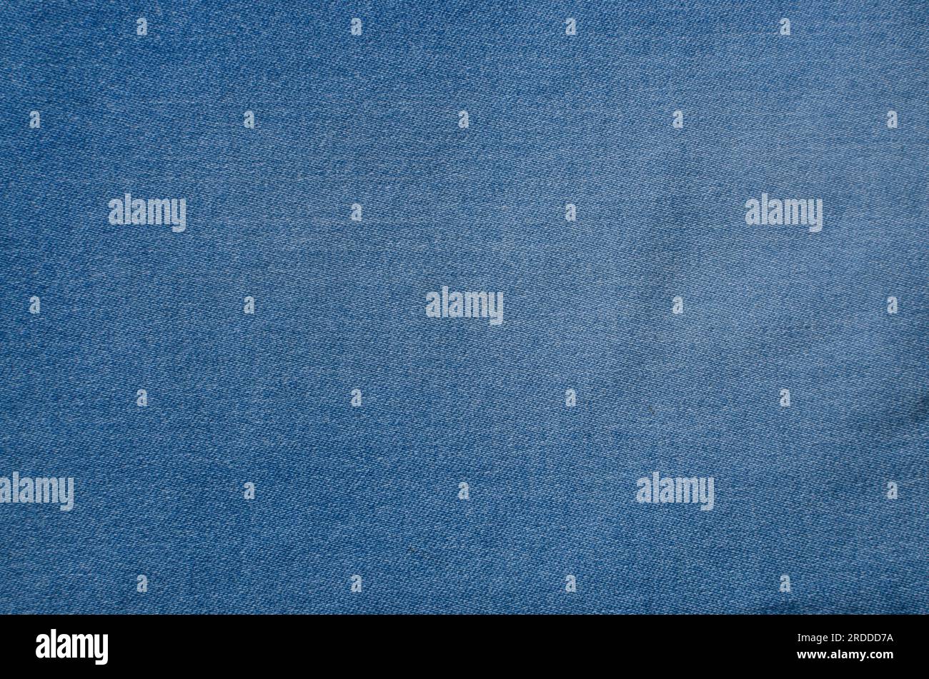 Close-up of a denim texture in detail, highlighting the intertwined ...