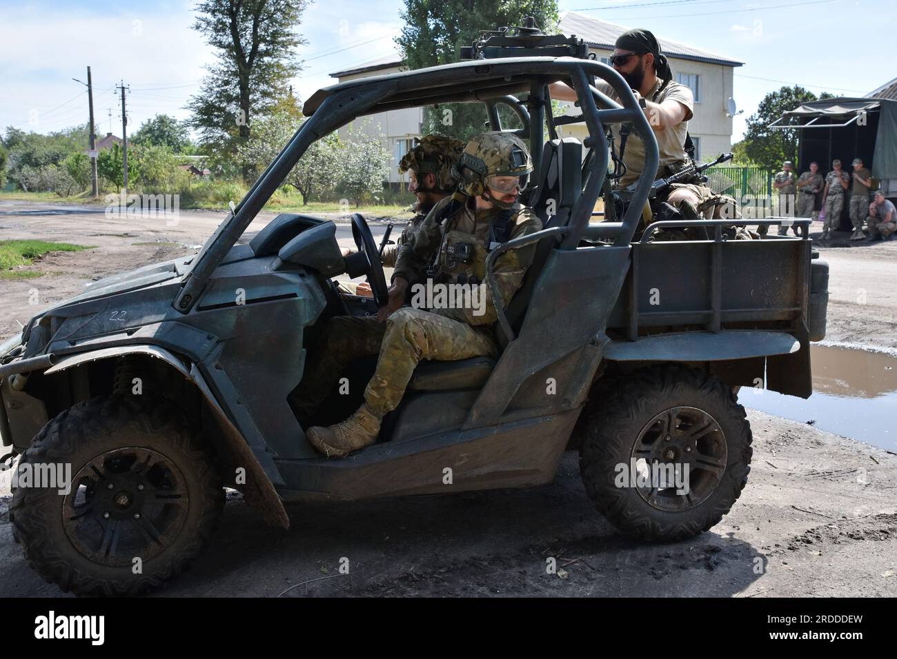 Ukrainian army soldiers drive towards the frontline on a combat buggy ...