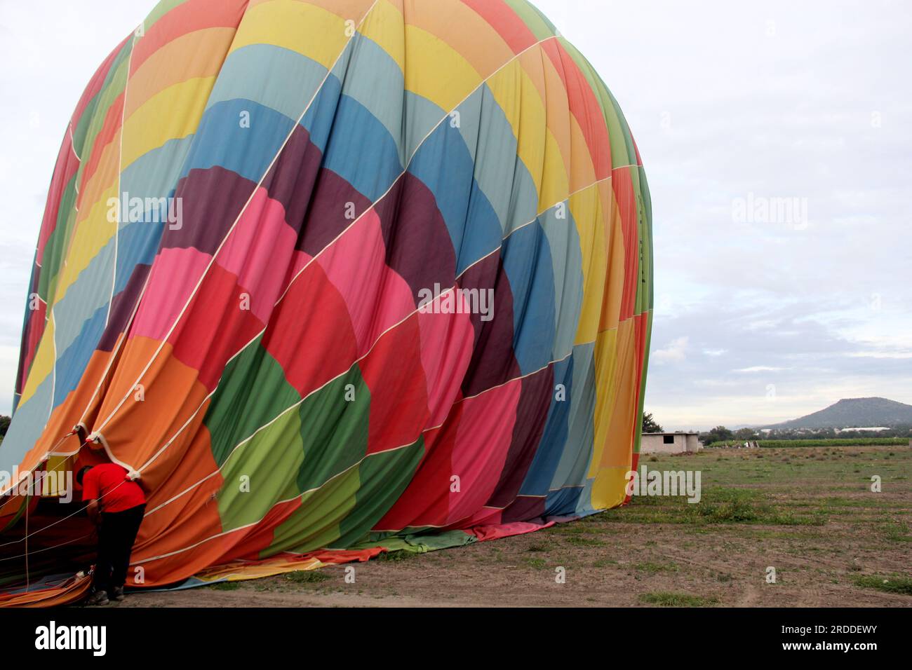 Process of inflation and preparation of hot air balloon at sunrise for ...