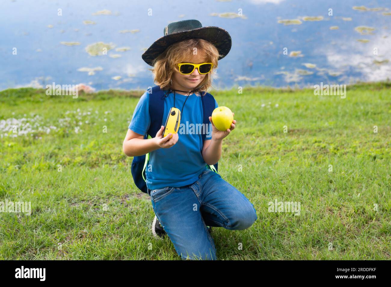 Scout boy wearing explorer hat and backpack outdoor. Explorer and adventure with binocular Stock ...