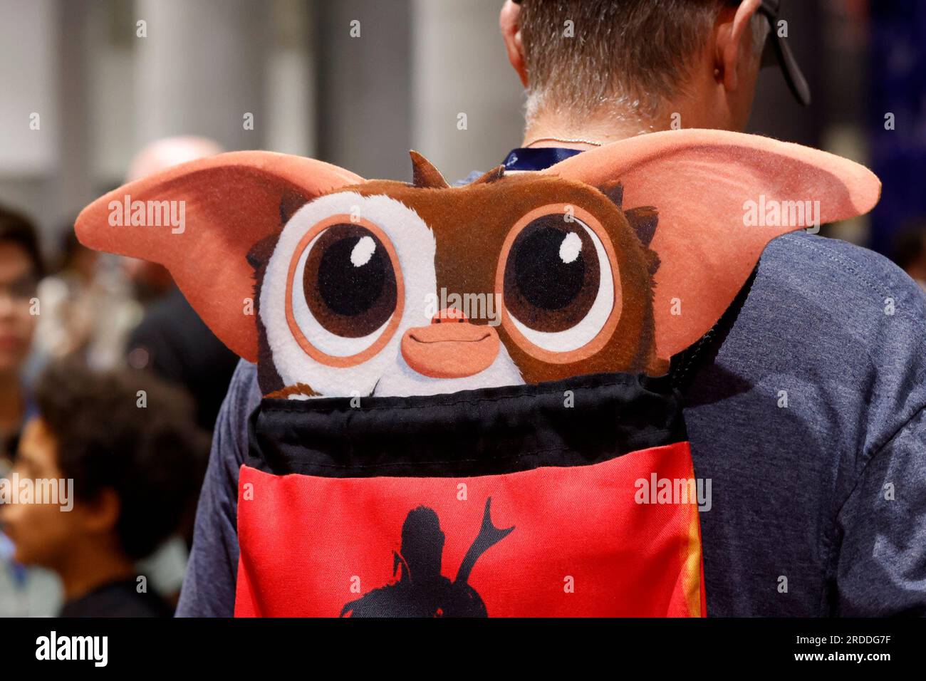 An attendee wears a Gremlin backpack at Comic-Con International on ...