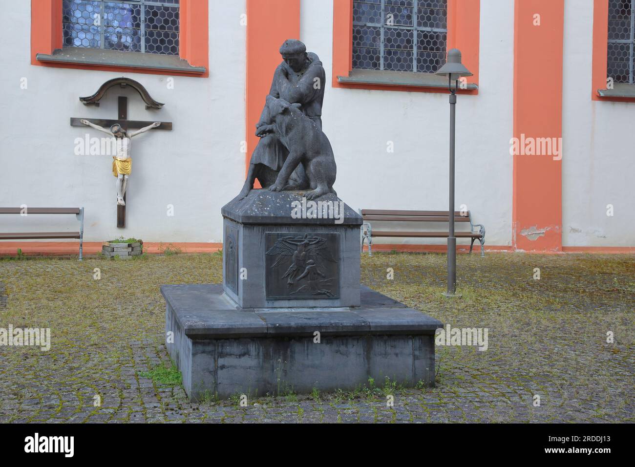 Monument and sculpture of Saint Francis with a wolf figure at the ...