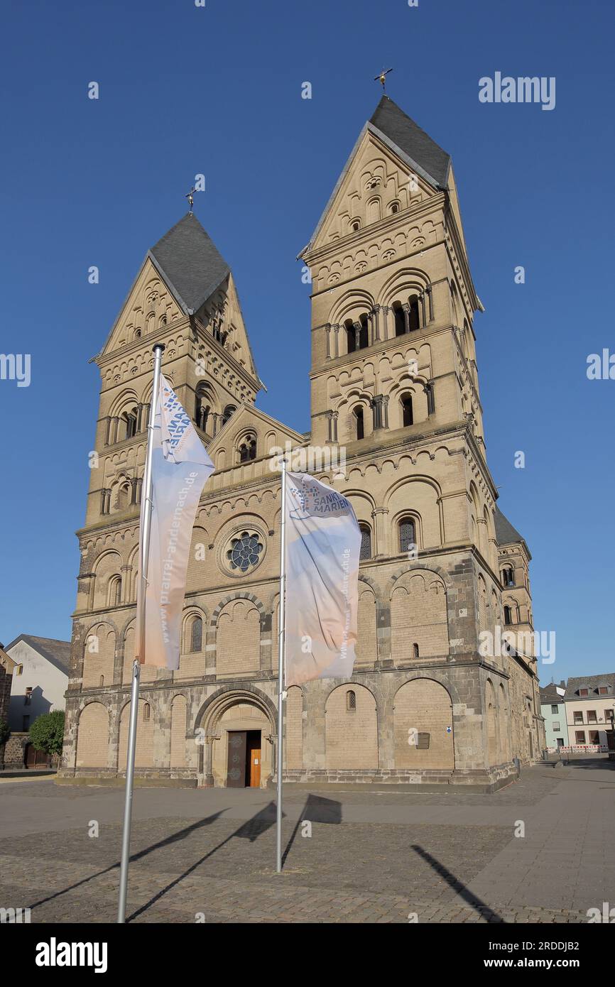 Late Romanesque Maria Assumption Church with twin towers and flags ...