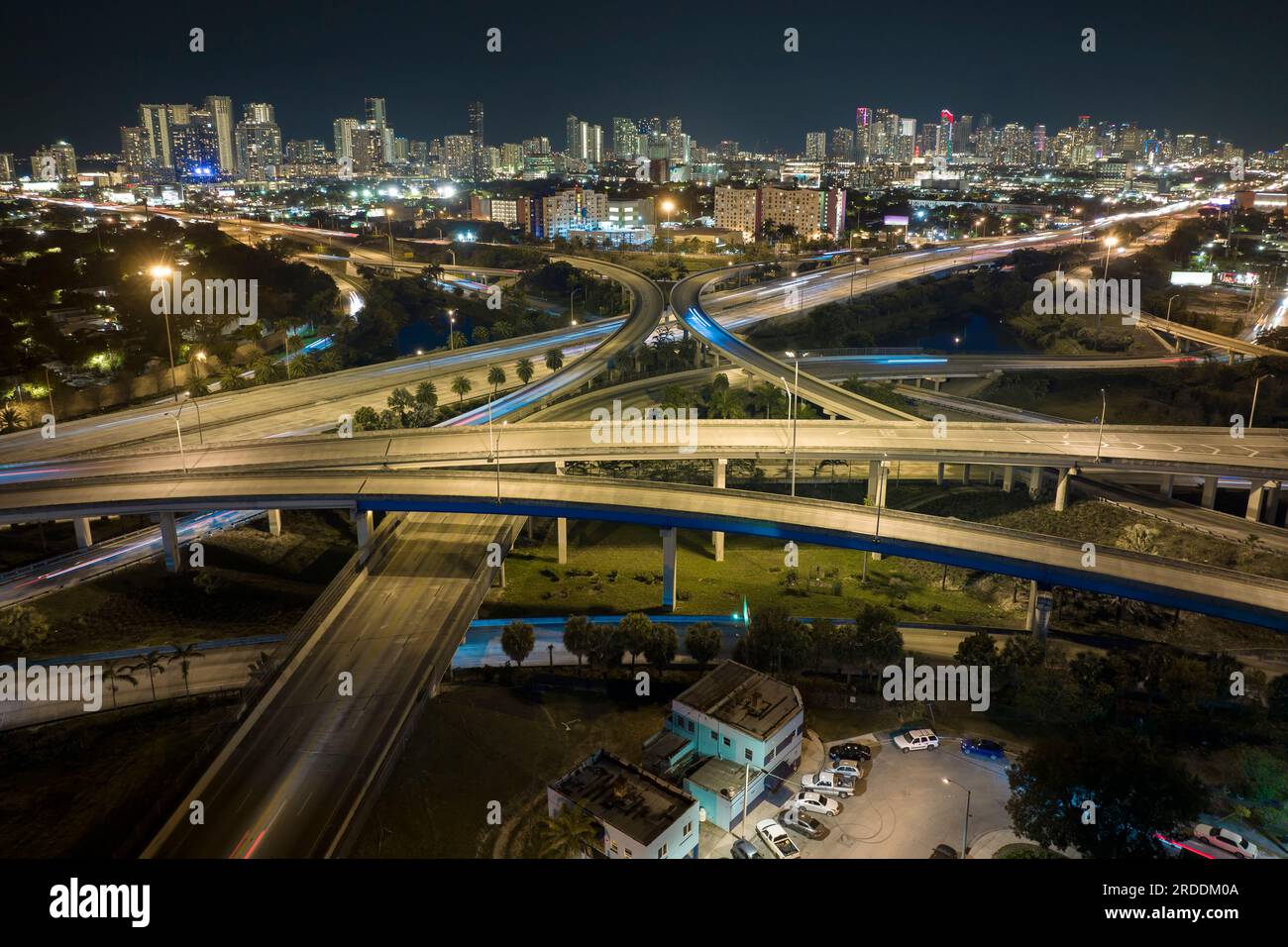 Aerial view of american highway junction at night with fast driving ...