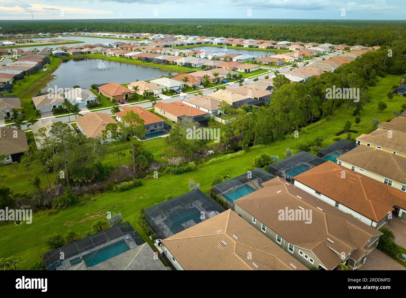 Aerial view of expensive modern houses with outside swimming pools ...