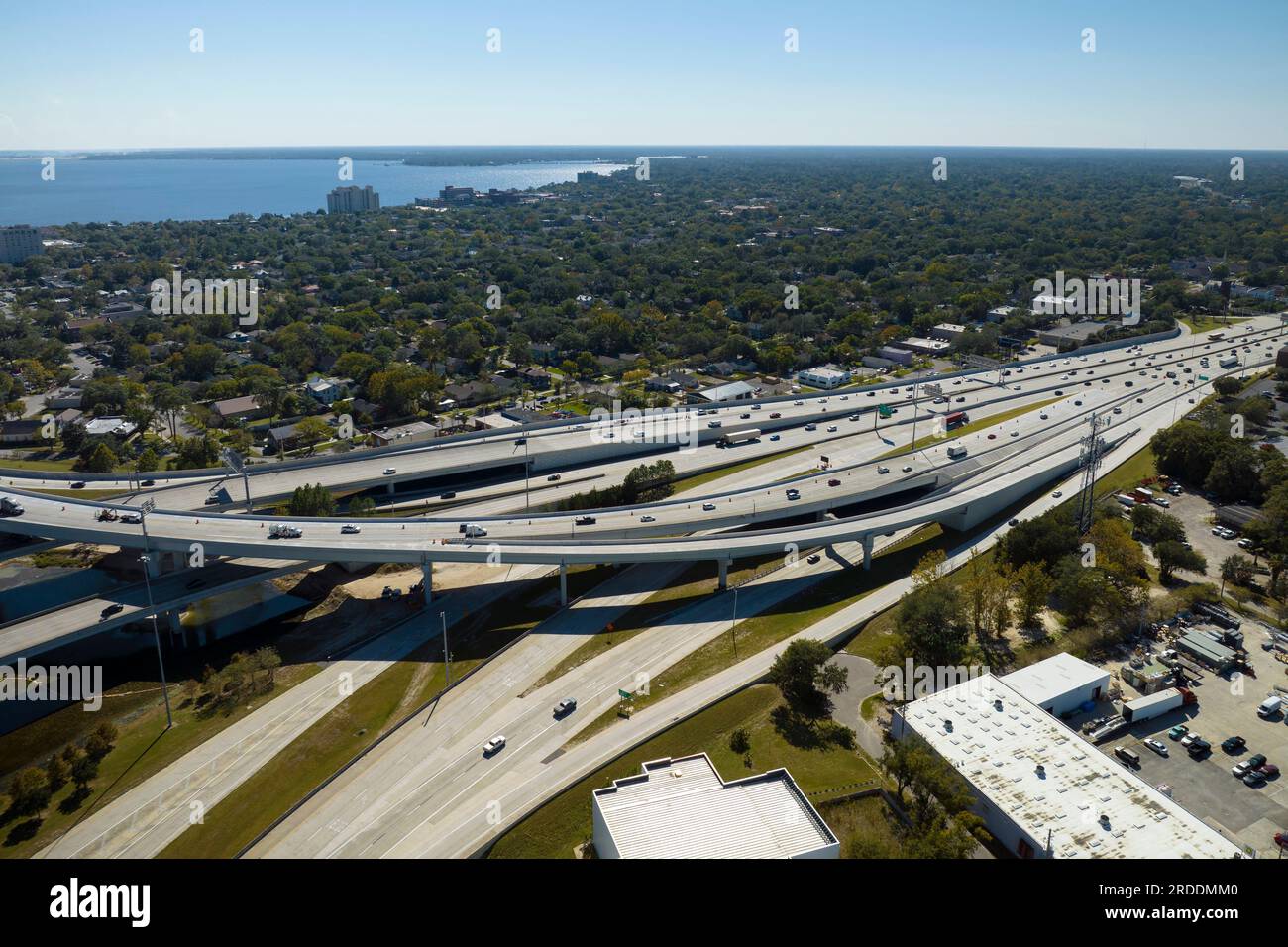 Aerial view of highway overpass with moving traffic cars and trucks ...