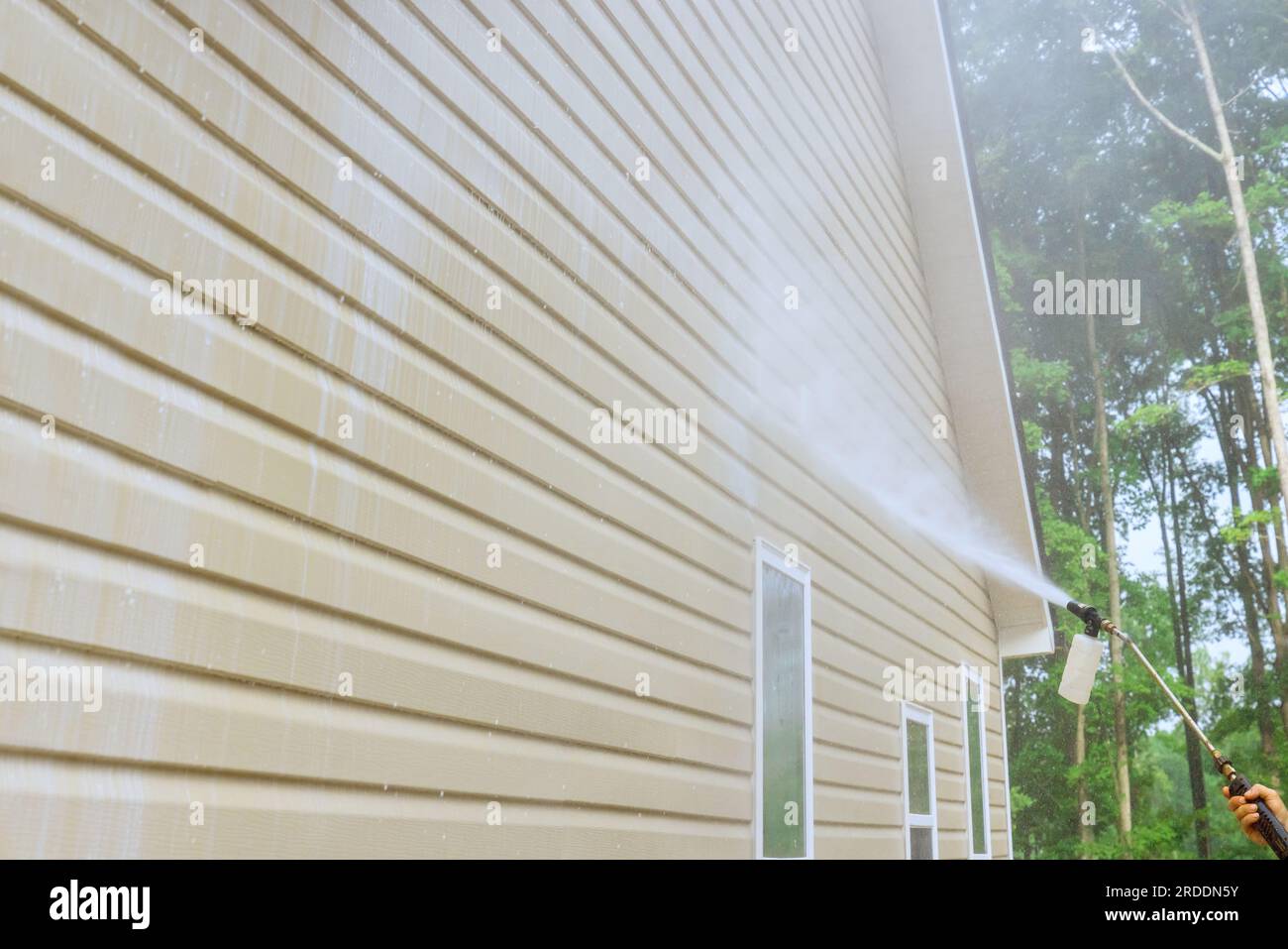 Service worker utilizes high pressure nozzles to efficiently clean ...