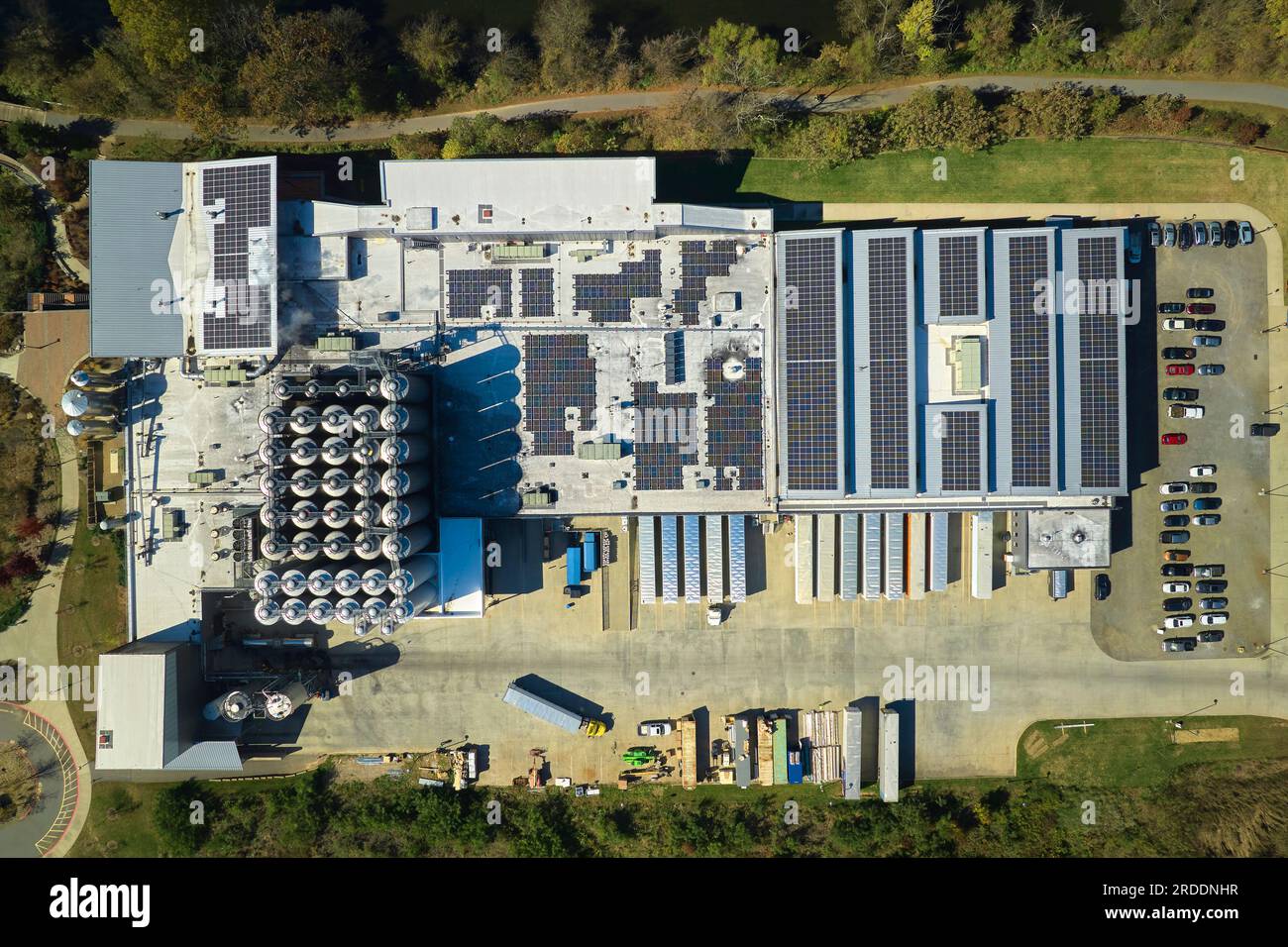 Aerial view of solar power plant with blue photovoltaic panels mounted ...