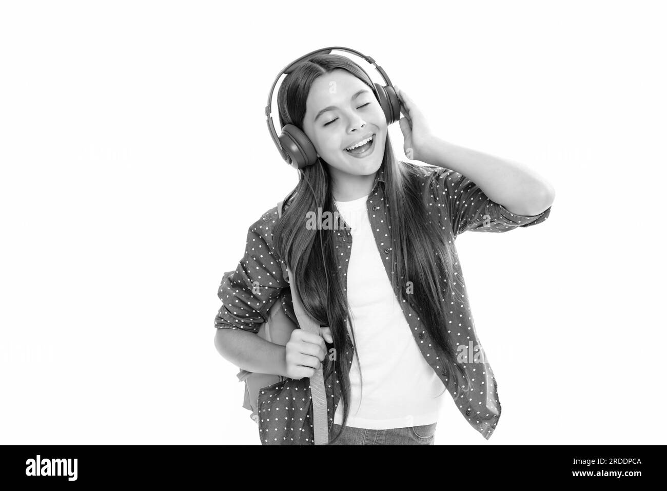 Amazed child singing. Back to school. Schoolgirl student in headphones ...