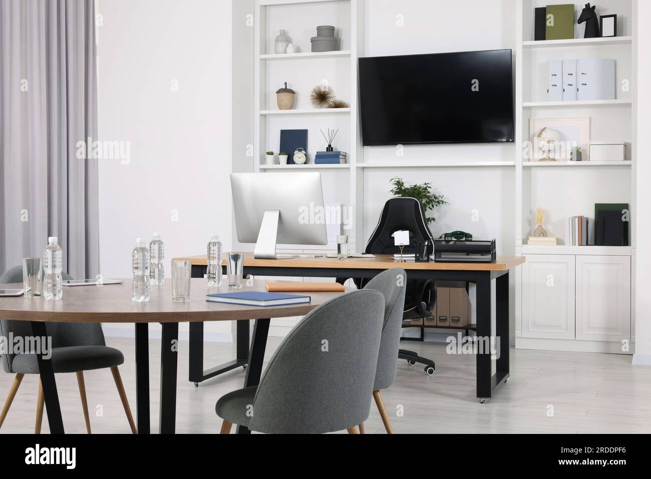 Stylish office with comfortable furniture and tv zone. Interior design ...