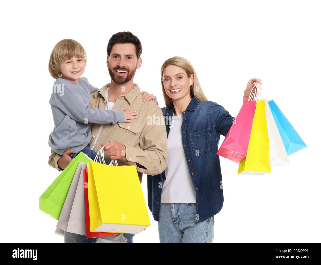 Family shopping. Happy parents and son with many colorful bags on white ...
