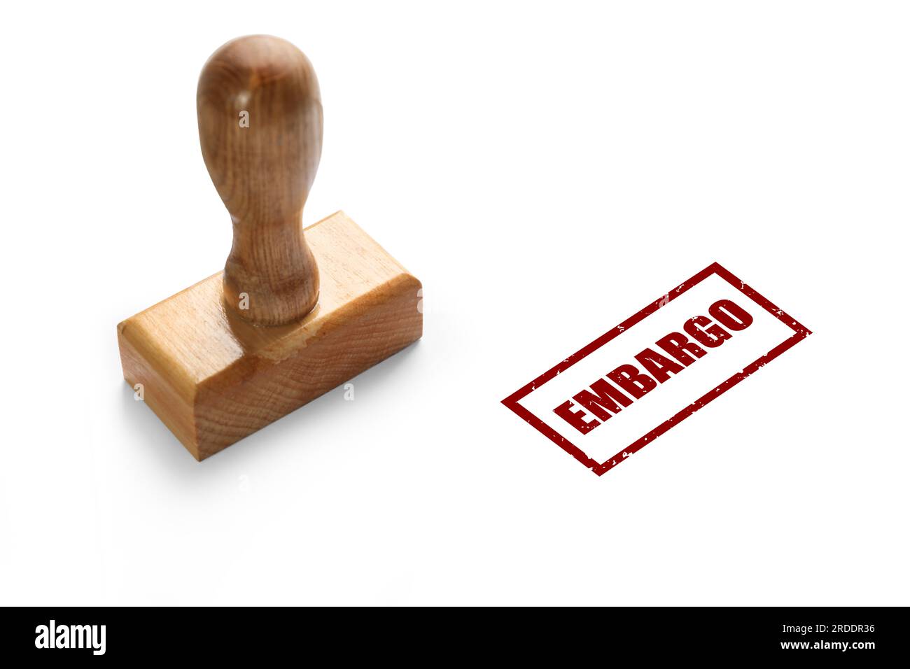 Economic sanctions. Wooden stamp and red mark Embargo on white ...
