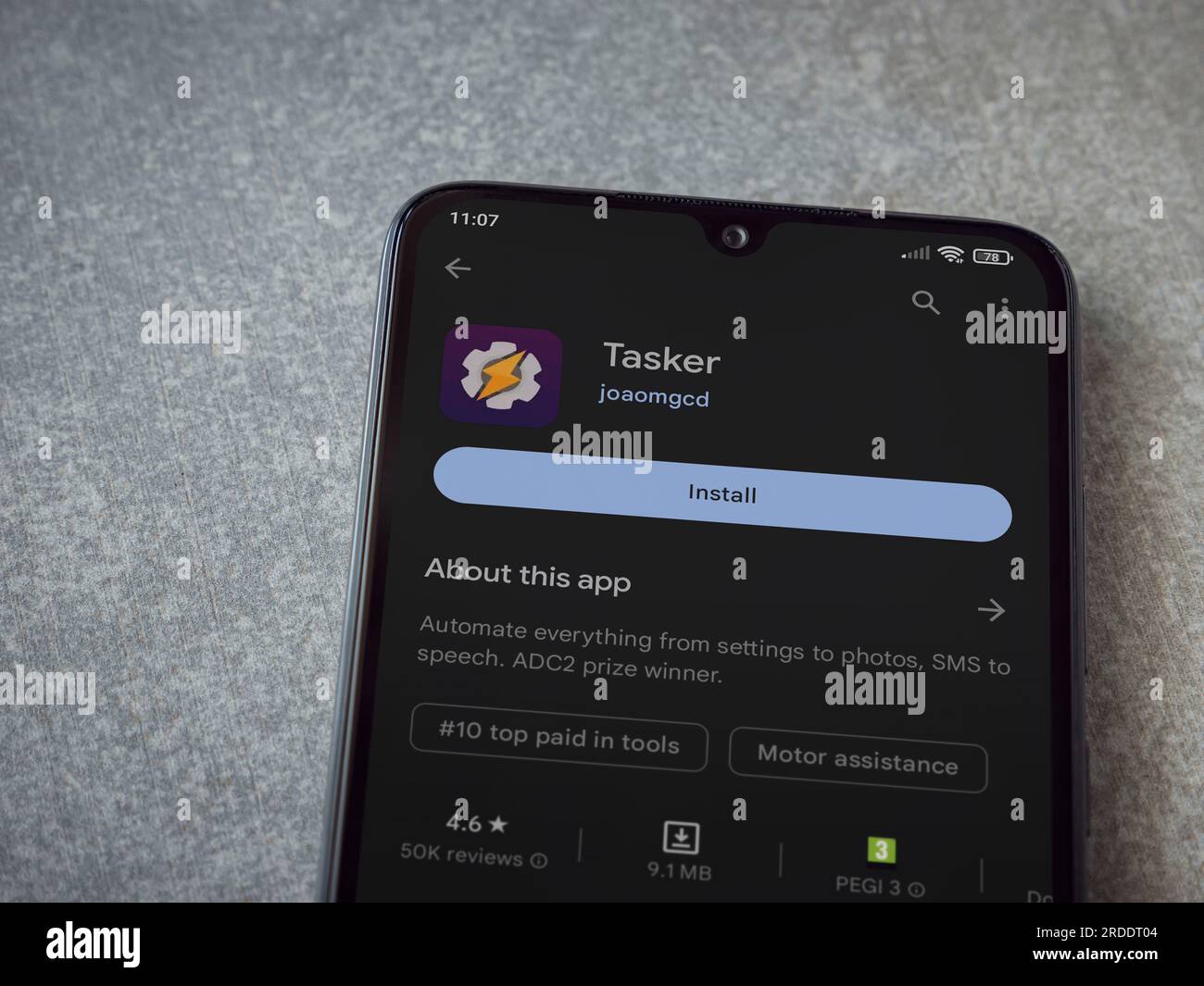 Lod, Israel - July 16,2023: Tasker app play store page on smartphone on ceramic stone background ...