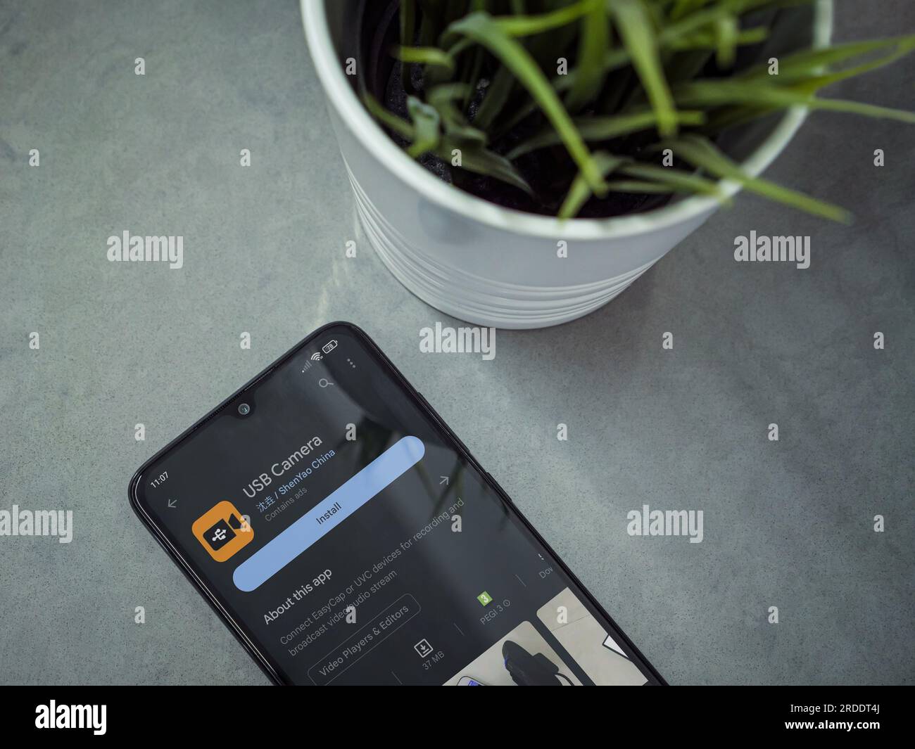 Lod, Israel - July 16,2023: Modern workspace with smartphone with USB Camera app play store page ...