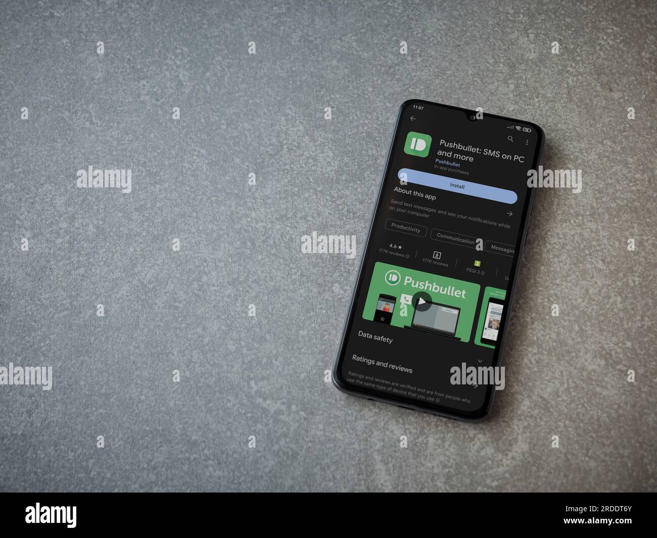 Lod, Israel - July 16,2023: Pushbullet app play store page on smartphone on ceramic stone ...