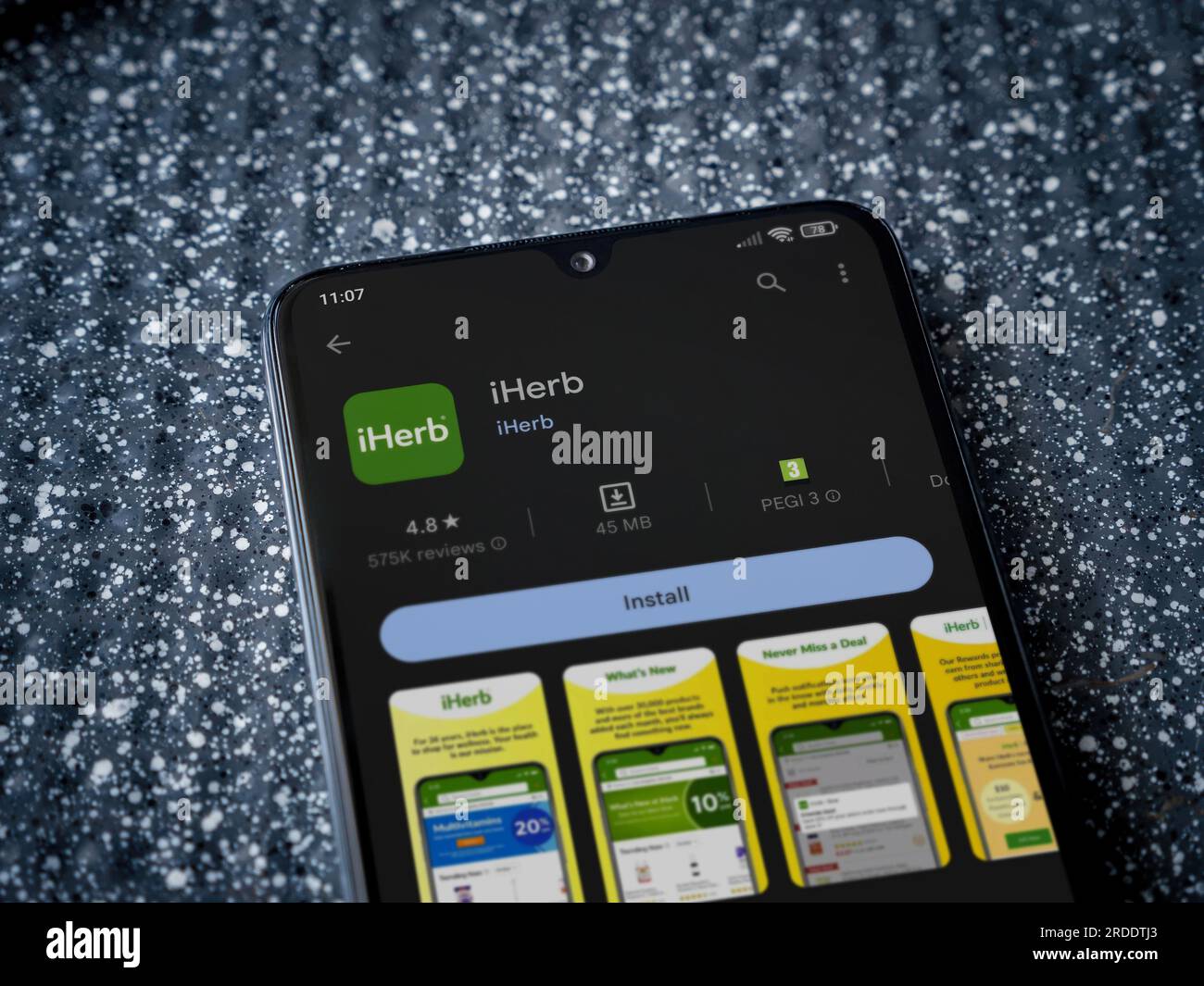 Lod, Israel - July 16,2023: iHerb app play store page on the display of a black mobile ...