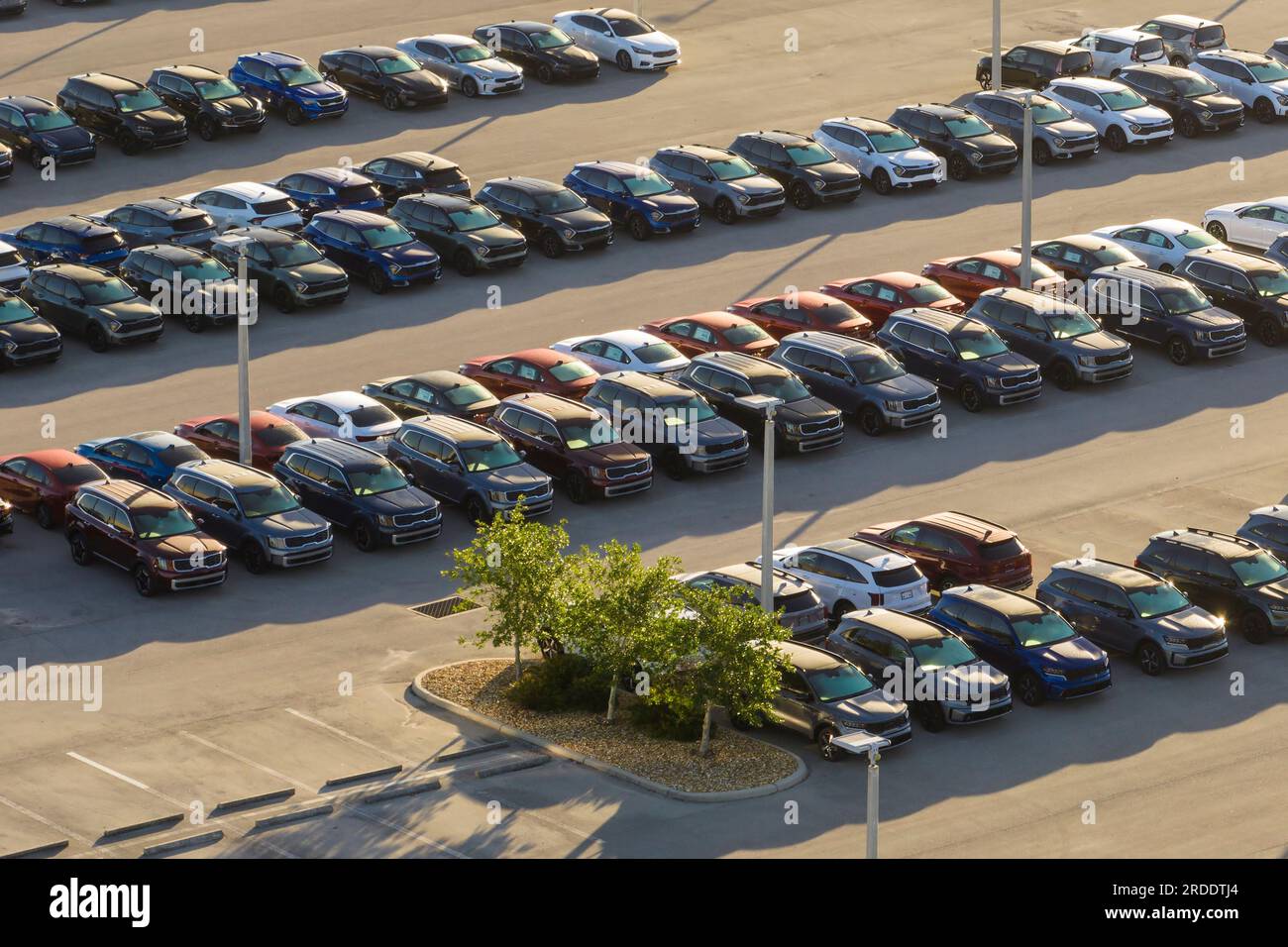 Large parking lot of local dealer with many brand new cars parked for ...