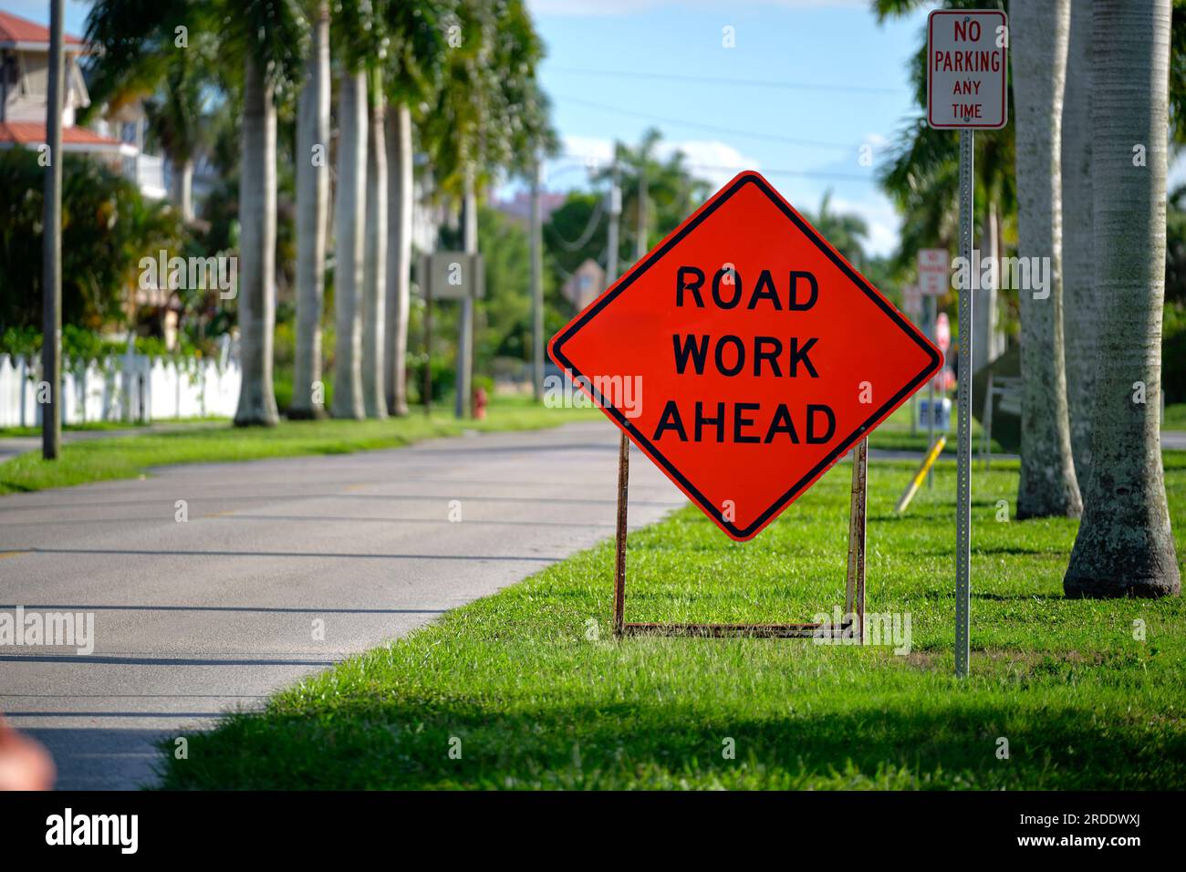 Road work ahead sign on street site as warning to cars about ...