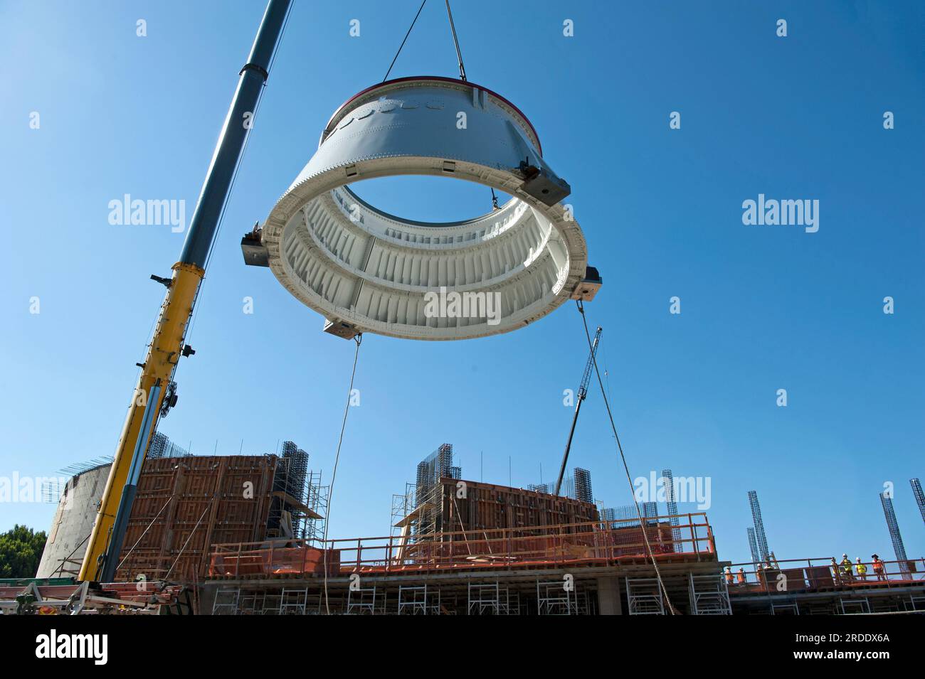 One of the aft skirts of the Endeavor Space Shuttle being lifted by ...
