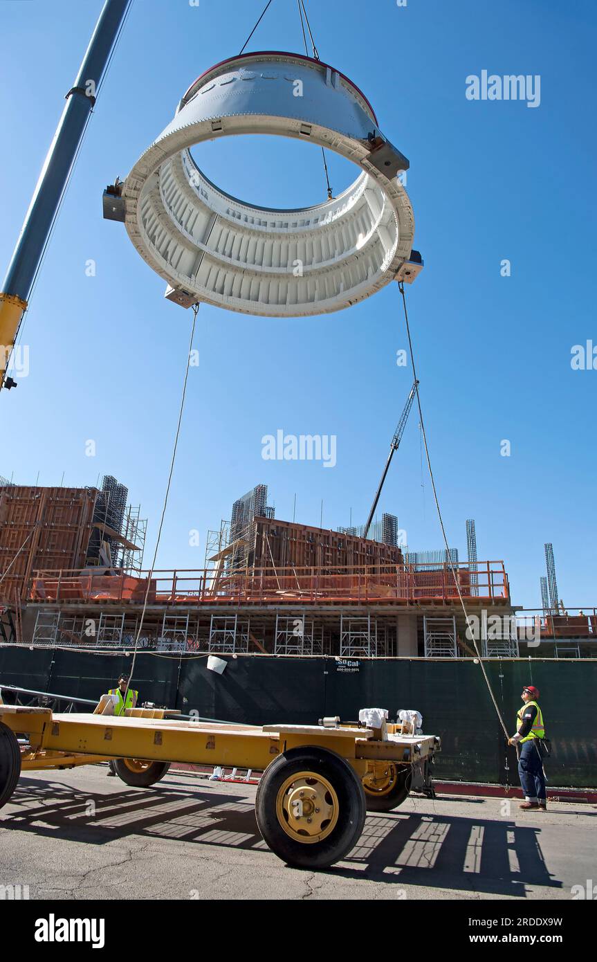 One of the aft skirts of the Endeavor Space Shuttle being lifted by ...