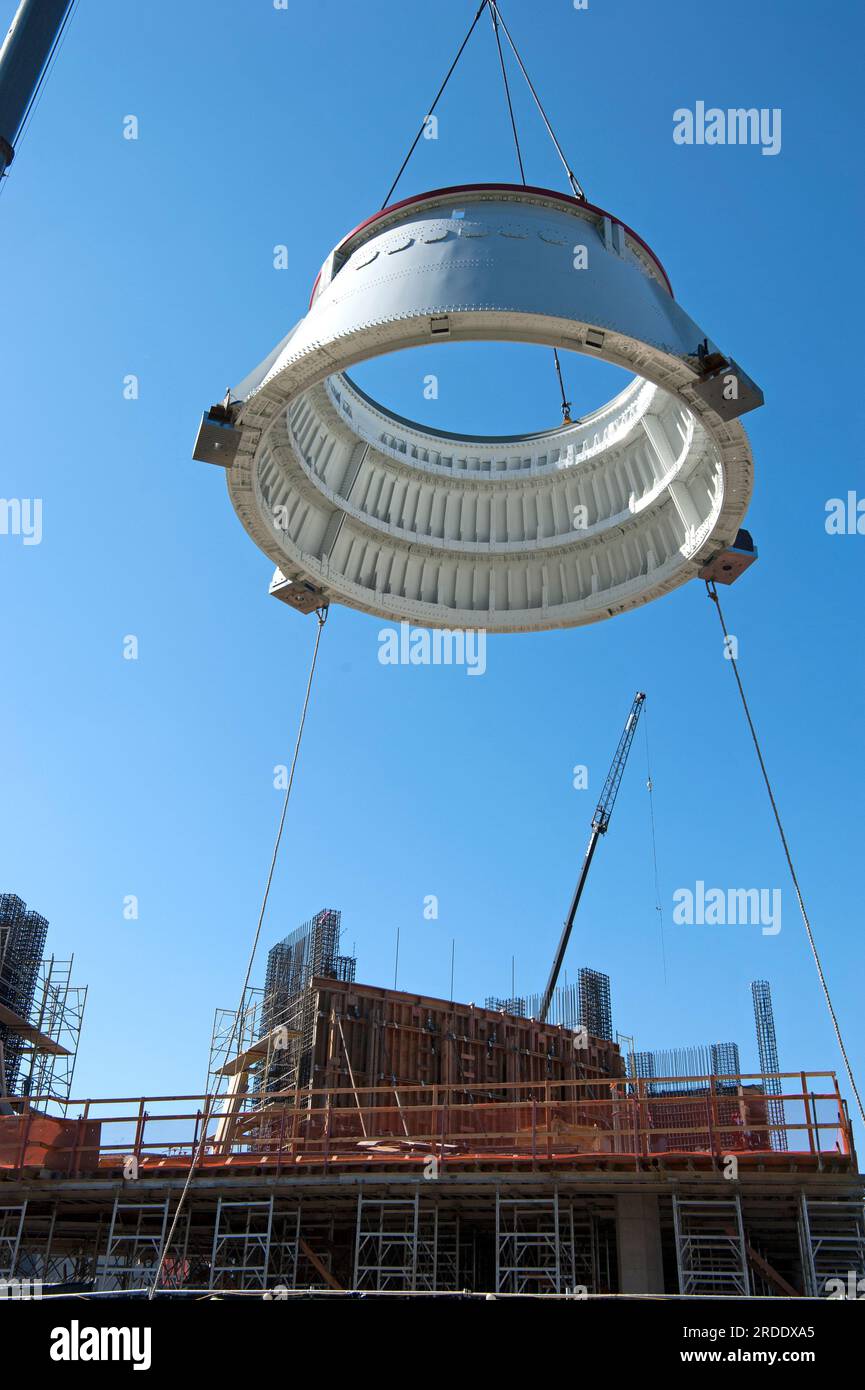 One of the aft skirts of the Endeavor Space Shuttle being lifted by ...