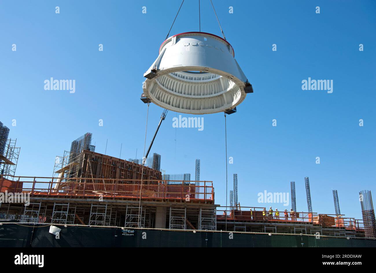 One of the aft skirts of the Endeavor Space Shuttle being lifted by ...