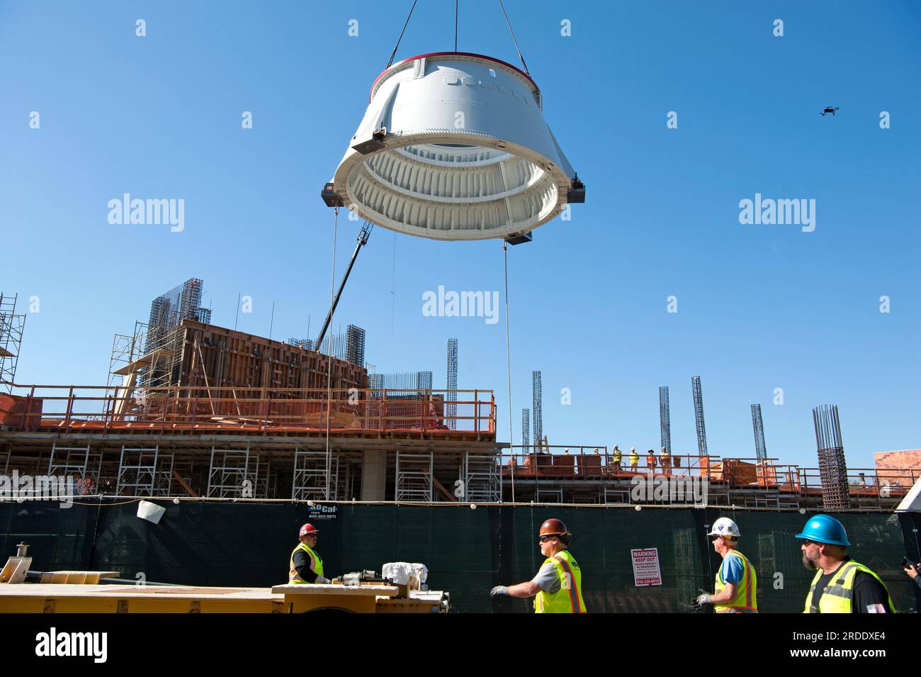 One of the aft skirts of the Endeavor Space Shuttle being lifted by ...