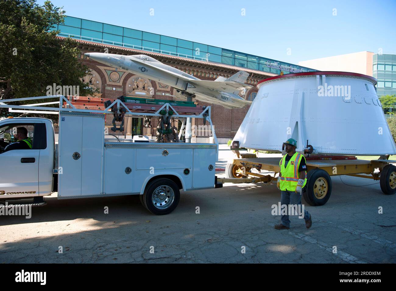 Workmen transporting one of the aft skirts of the Endeavor Space ...