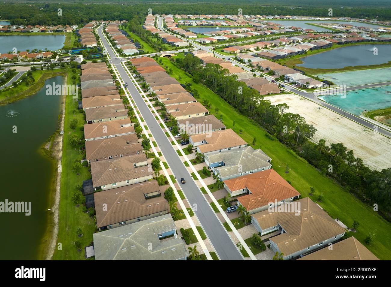 Aerial view of real estate development with tightly located family ...