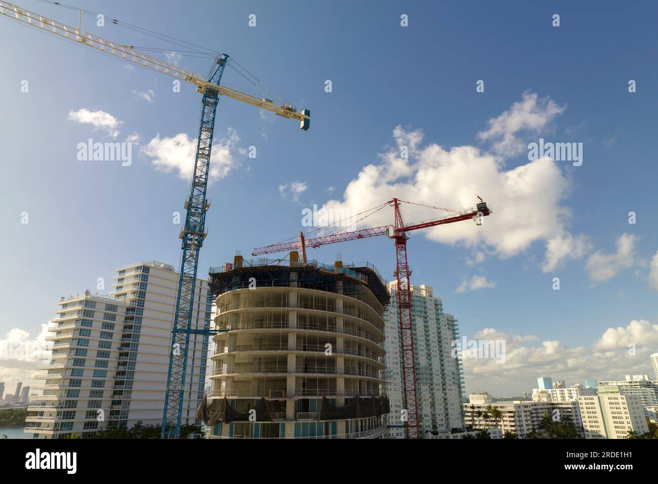 Tower lifting cranes at high residential apartment building ...