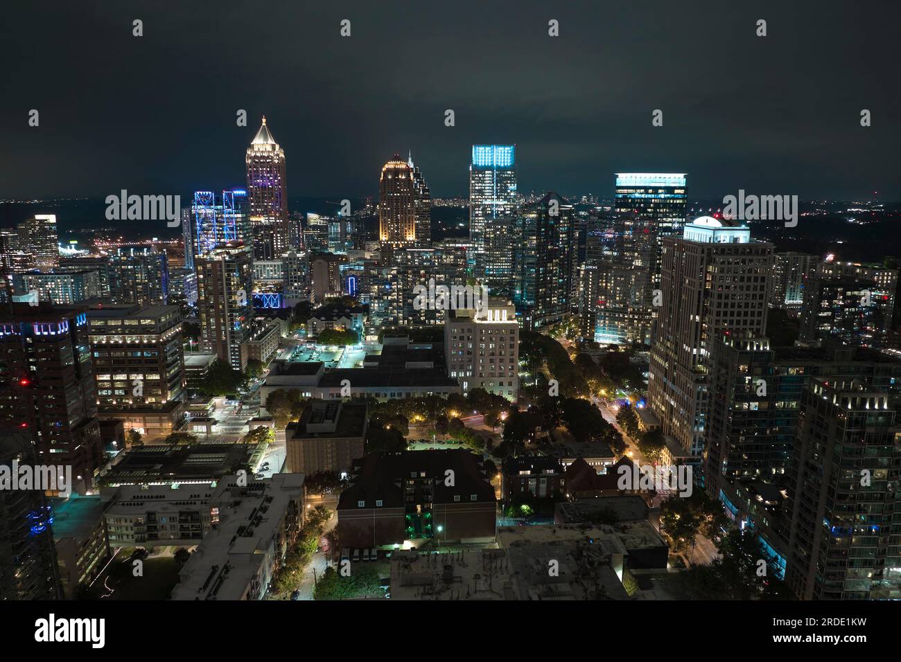 View from above of brightly illuminated high skyscraper buildings in ...