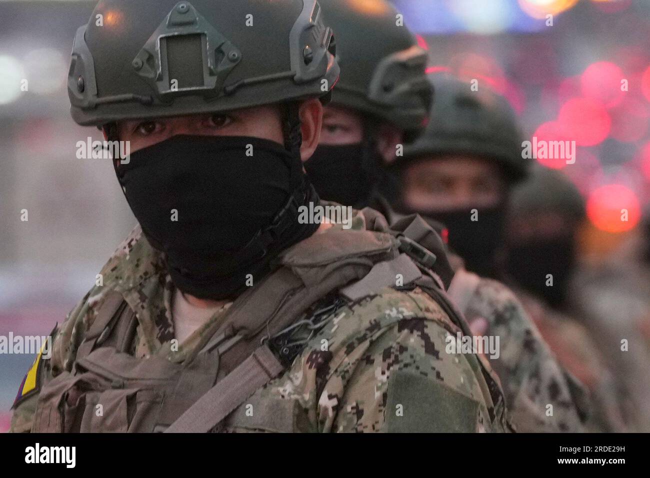 Soldiers guard vehicle traffic on the National Unity Bridge that ...