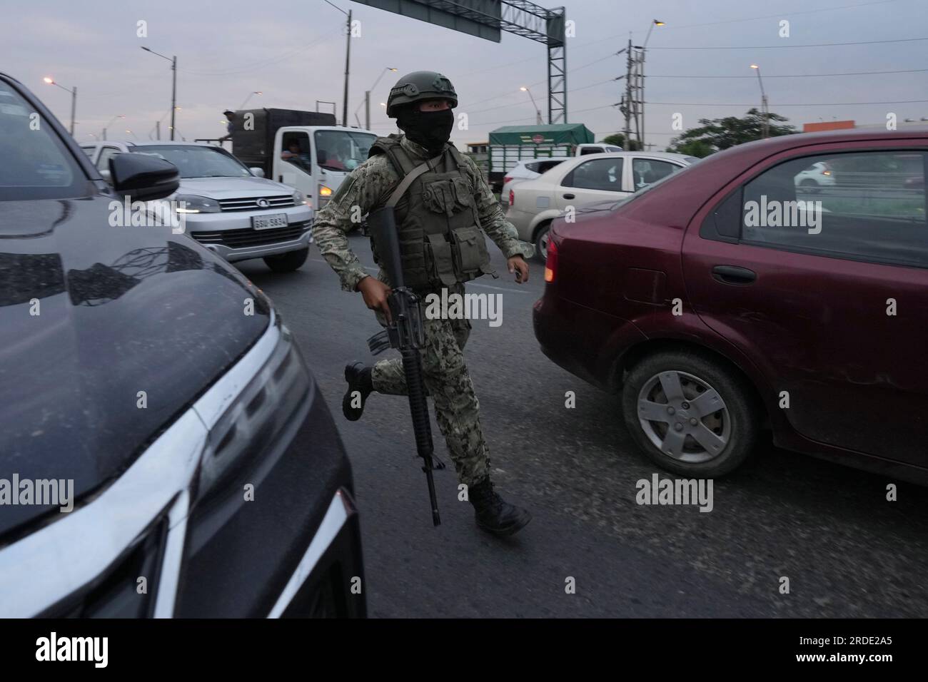 A soldier runs in the middle of the traffic on the National Unity ...