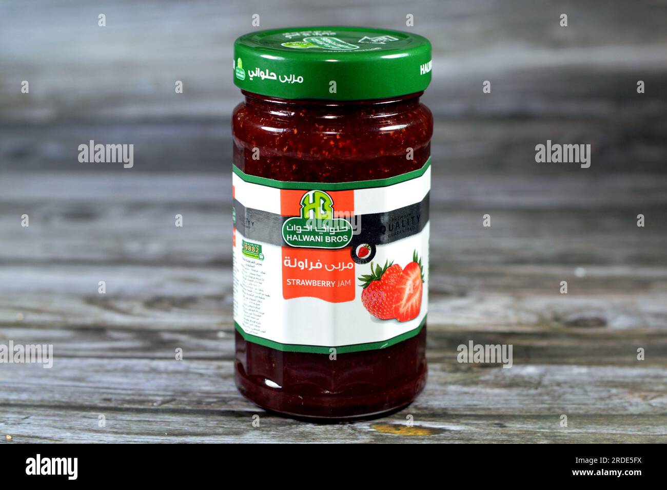 Cairo, Egypt, July 9 2023: Halwani Bros strawberry jam Haalwani bottle ...