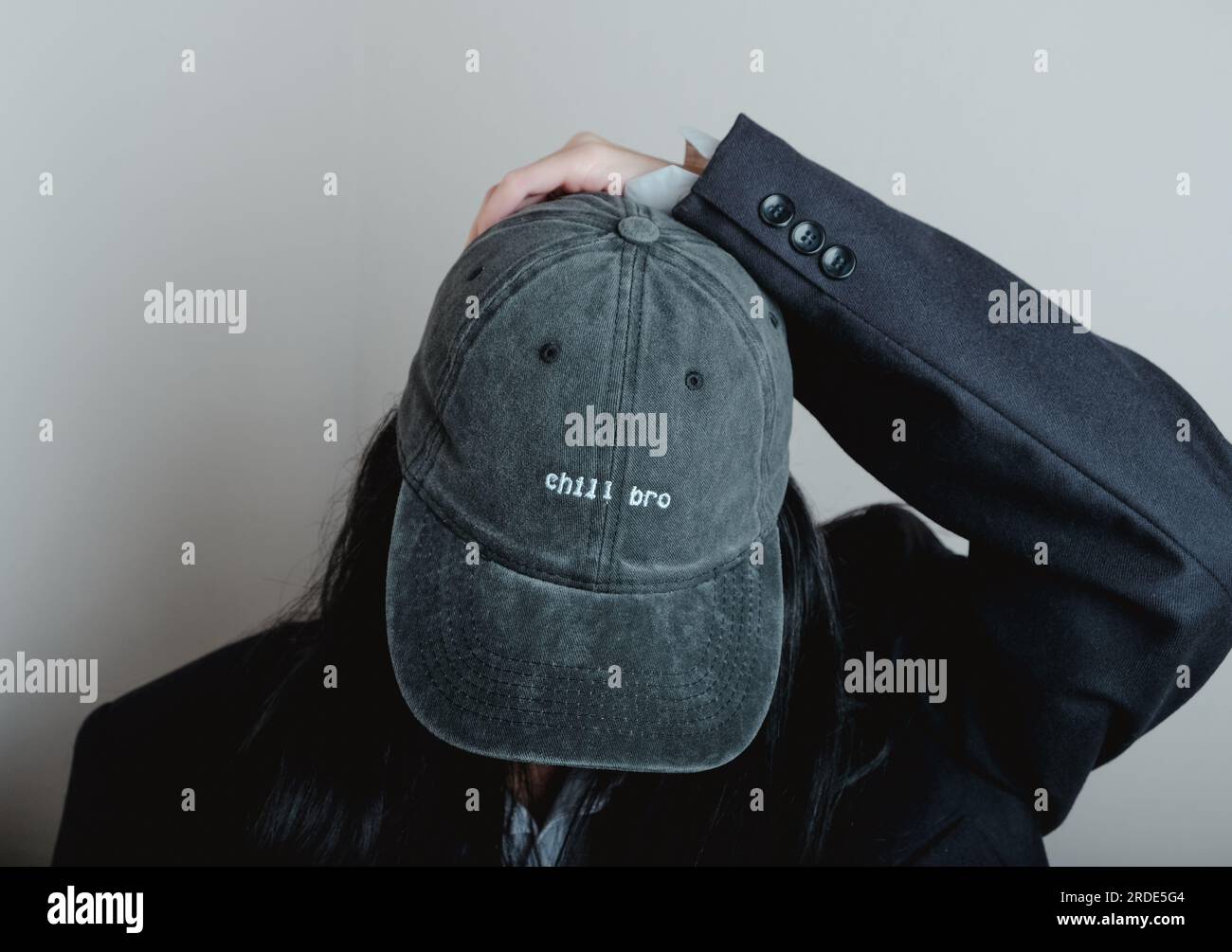 Cool And Confident Girl In Gray Cap With ‘Chill bro’ Words On It Stock ...