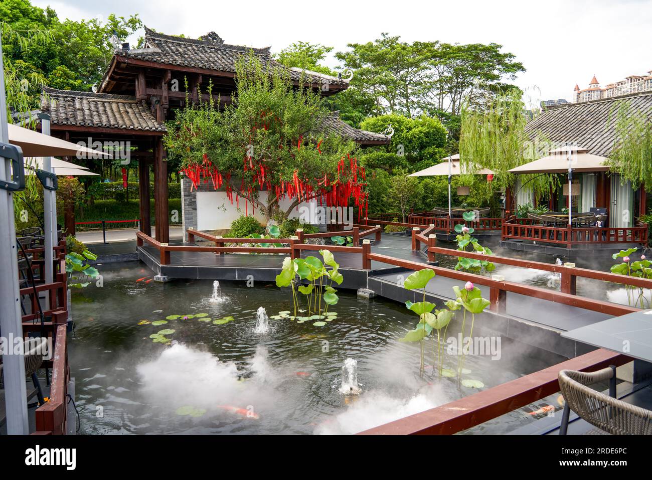 Luxurious Chinese garden restaurant seats and ancient building turret ...