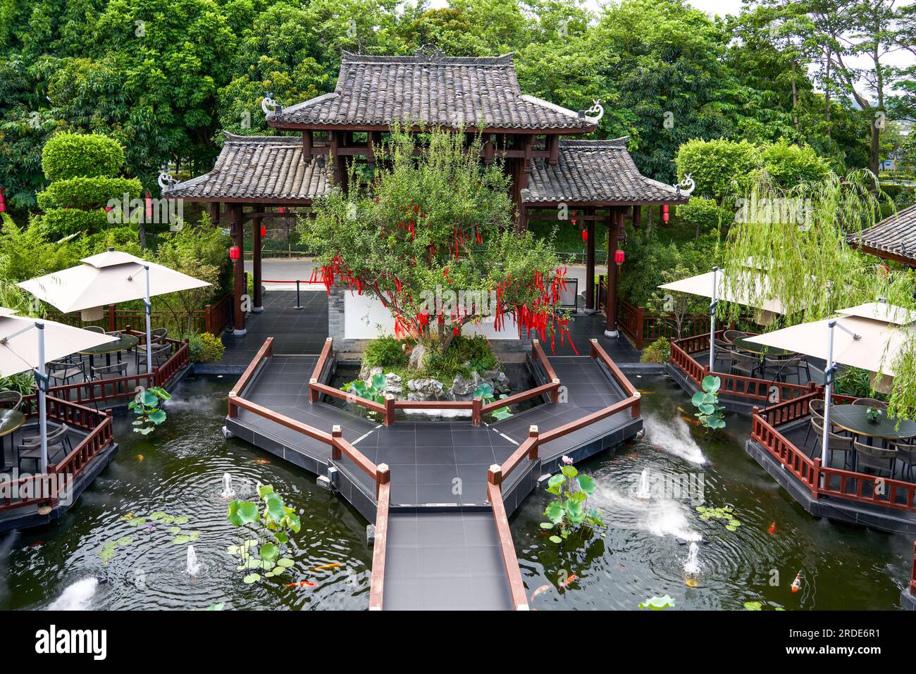 Luxurious Chinese garden restaurant seats and ancient building turret ...