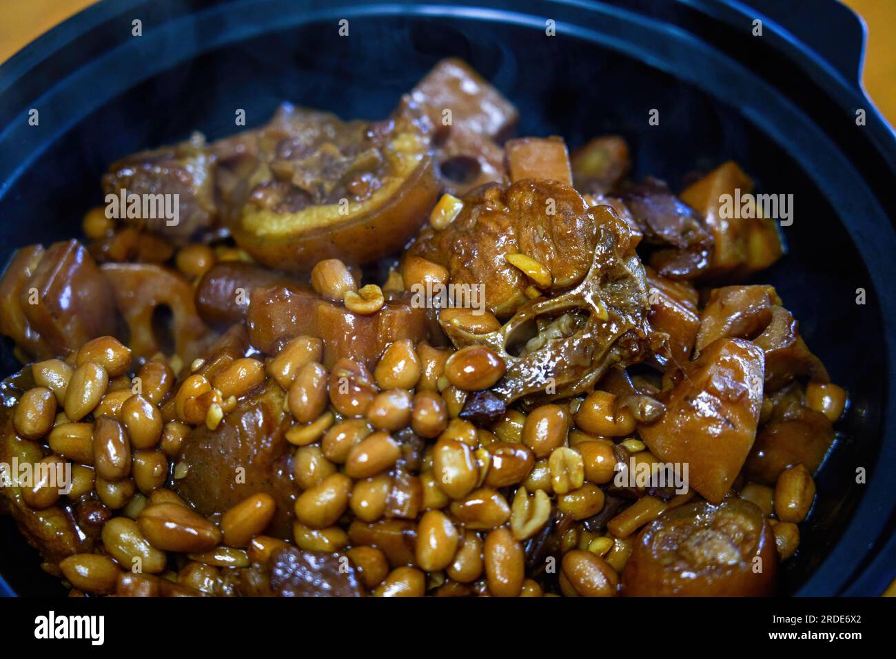A delicious Chinese dish, Braised Pig Tail with Peanuts Stock Photo - Alamy