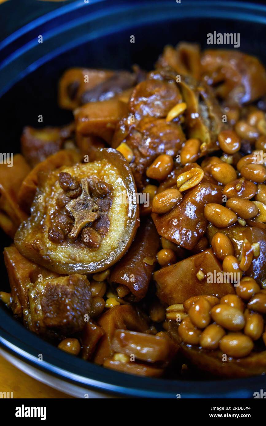 A delicious Chinese dish, Braised Pig Tail with Peanuts Stock Photo - Alamy
