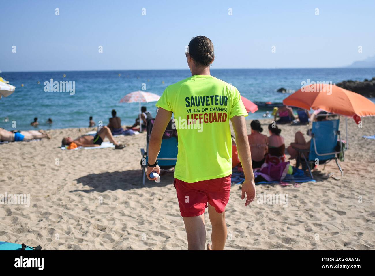 Cannes, France. 20th July, 2023. A lifeguard checks water's temperature ...