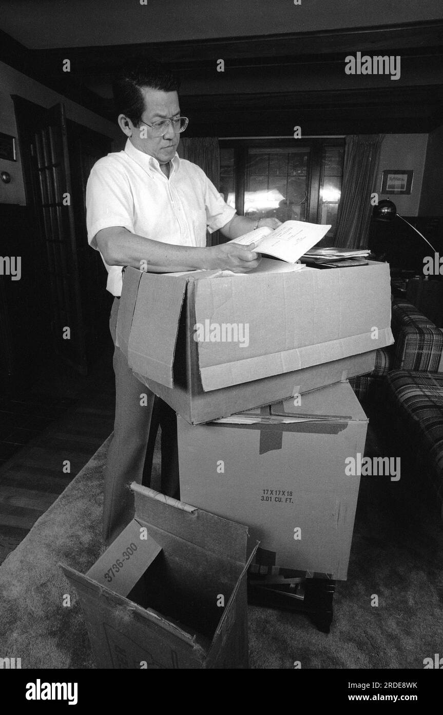 Former opposition leader Benigno S. Aquino, packs books and personal ...
