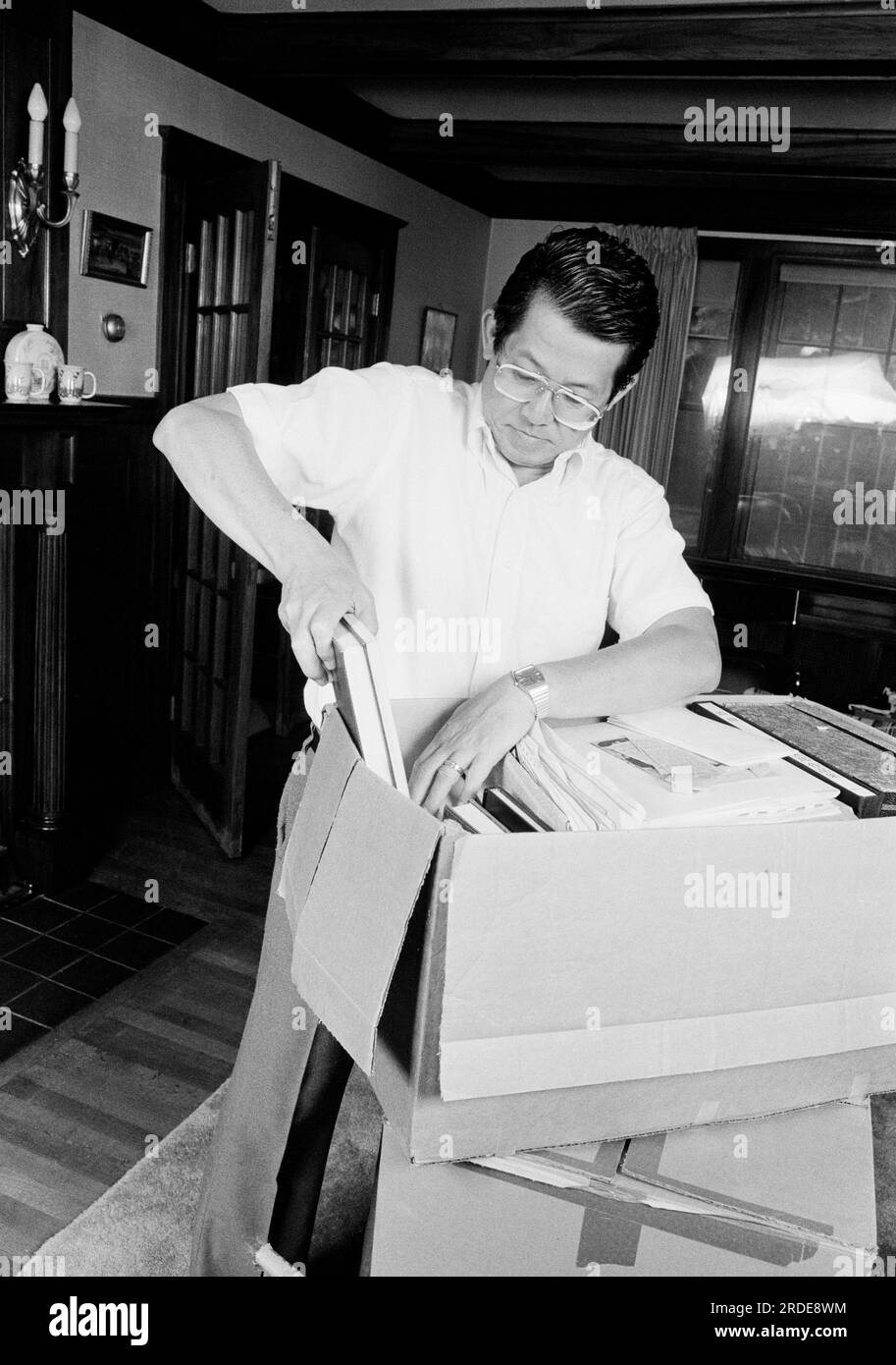 Former opposition leader Benigno S. Aquino, packs books and personal ...