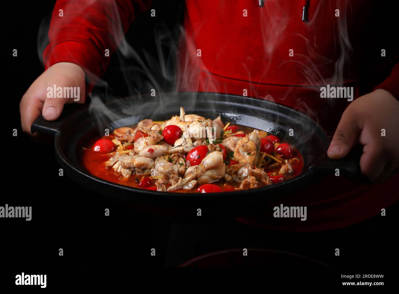 Frog with Pickled Pepper, bullfrog in sour soup Stock Photo - Alamy