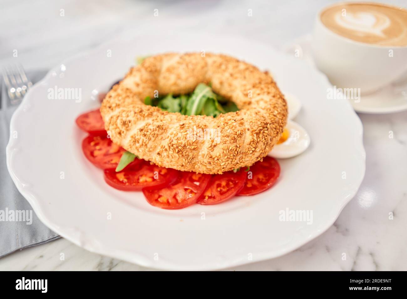 Turkish breakfast with simit, cheese, tomato, cucumber, olives ...