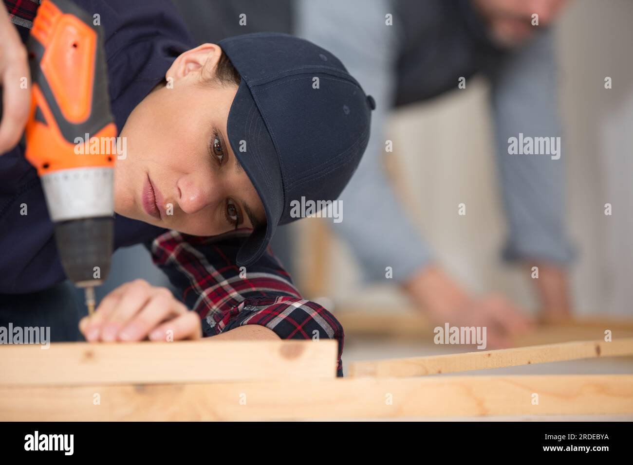 pretty young woman holding screwdriver Stock Photo - Alamy