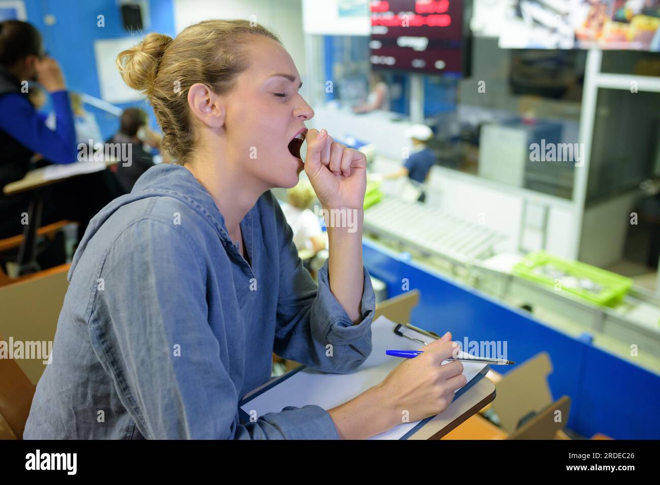 female worker yawning in fish market Stock Photo - Alamy