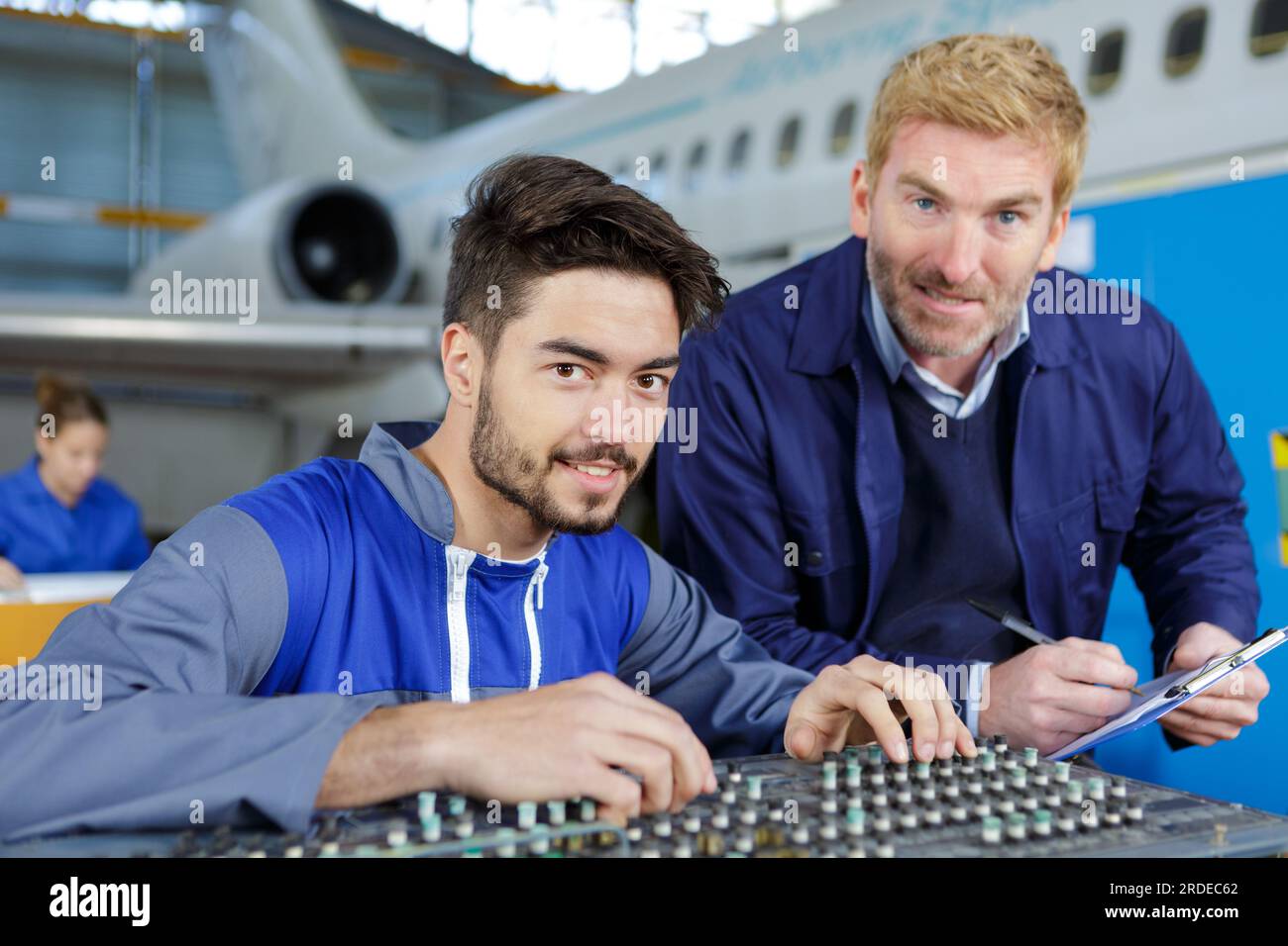 men engineers working on airplane sound Stock Photo - Alamy